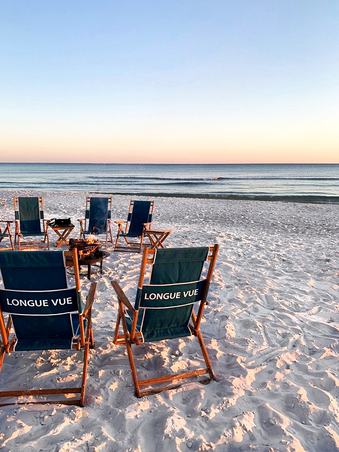 Beach chairs patiently await their temporary occupants, promising front-row seats to nature's greatest show—sunset over the Gulf.