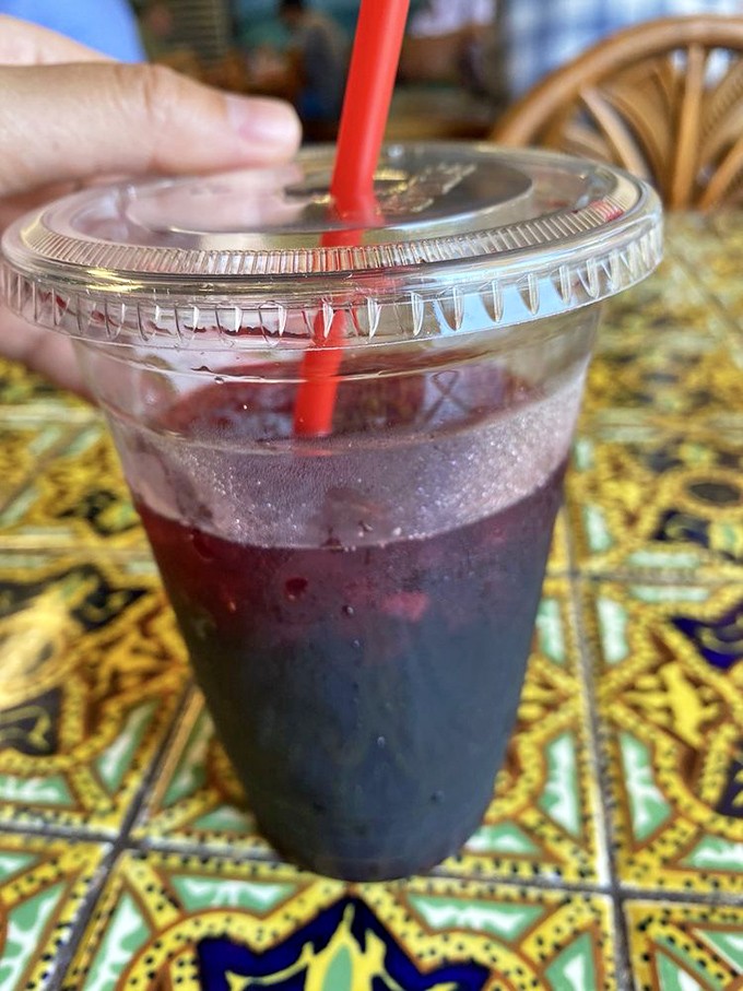The jamaica agua fresca—nature's perfect palate cleanser. This ruby-red refresher stands ready to rescue taste buds from spice emergencies while adding its own sweet melody.