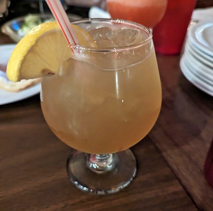 The perfect companion to cut through all that cheese and sauce—a bright, citrusy amaretto sour that refreshes between bites of pizza perfection.