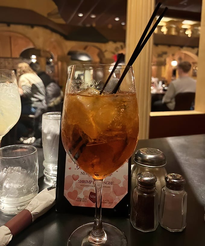 The Aperol Spritz—Italy's sunset in a glass—sits ready to transport you to a Venetian canal, even if you're just in Rockford on a Tuesday.