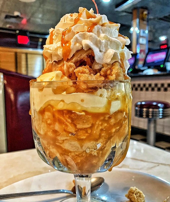 Not just dessert, but a monument to excess—layers of warm apple cobbler, ice cream, and caramel that make diets spontaneously combust.