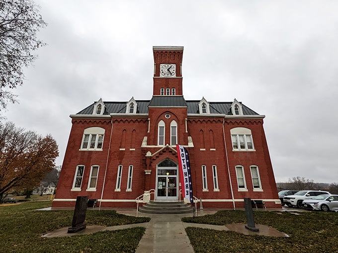 The magnificent Atchison County Courthouse commands attention with its striking red brick and clock tower—a centerpiece of civic pride since its construction.