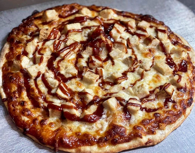 BBQ chicken pizza that doesn't try to reinvent the wheel—just makes it deliciously round, saucy, and impossible to resist.