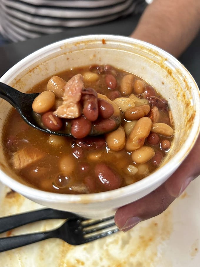These beans have clearly been hanging out with brisket all day, absorbing stories and smoke until they've become something extraordinary.