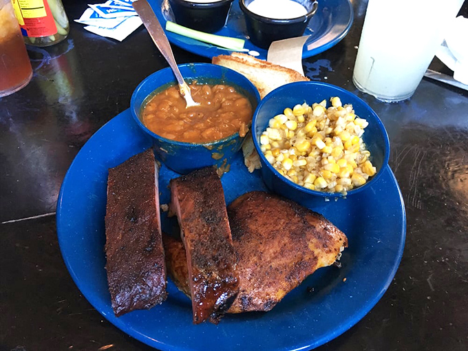 BBQ ribs and beans that would make a vegetarian weep with temptation. That smoke ring is the equivalent of a Michelin star in BBQ circles.