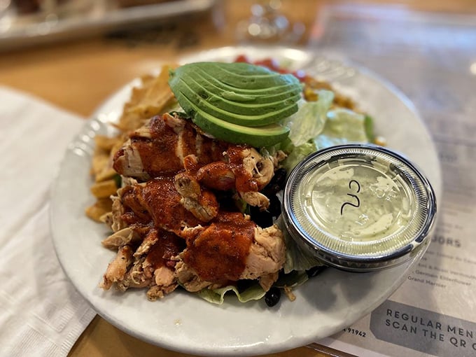BBQ chicken gets the California treatment with fresh greens and avocado—like your healthy salad made a delicious detour through the smoker.