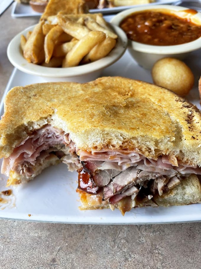 This sandwich doesn't just have layers—it has chapters. A meaty novel between two slices of griddled bread.
