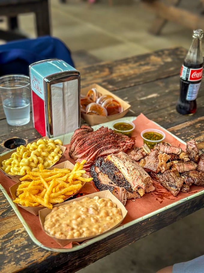 A BBQ platter that makes vegetarians question their life choices. That mac and cheese isn't a side—it's a co-star in this meaty blockbuster.