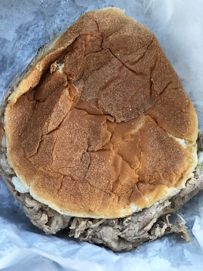 This sandwich isn't trying to impress Instagram—it's too busy preparing to impress your taste buds with generations of barbecue wisdom.