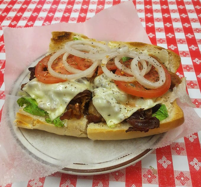 The BLT – proof that simplicity, when executed perfectly, can outshine complexity every time. The pickle stands guard like a tangy sentinel.