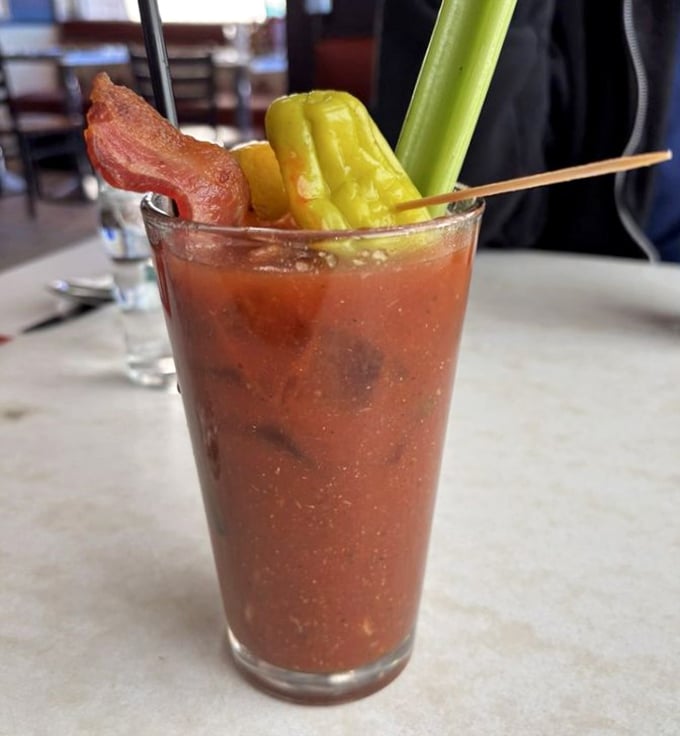 A Bloody Mary that doubles as both cocktail and appetizer – the bacon strip isn't garnish, it's an exclamation point.