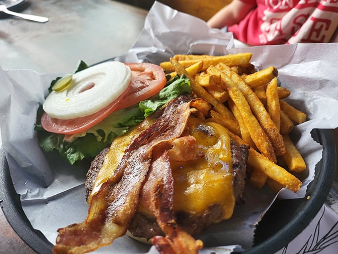 This isn't just a burger; it's architecture with bacon. The foundation is beef, the roof is cheese, and everything in between is bliss.