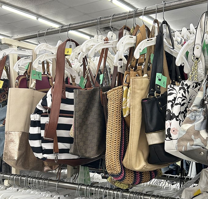 Designer handbags hang like exotic fruit, waiting for savvy shoppers to recognize their pedigree among the pleather pretenders.