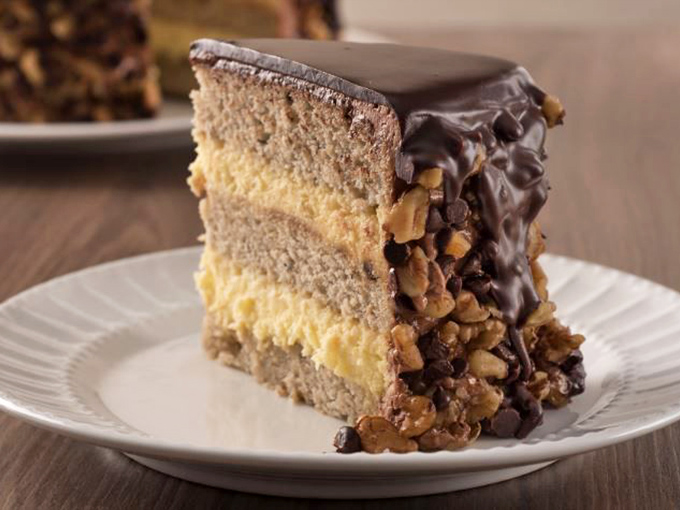 This banana dream cake doesn't just satisfy your sweet tooth—it throws a full-blown carnival for it, complete with chocolate ganache and walnut confetti.