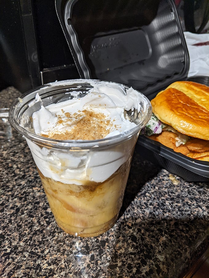 Banana pudding elevated to art form: layers of creamy custard, vanilla wafers, and whipped topping that could make even the most sophisticated dessert snob swoon.