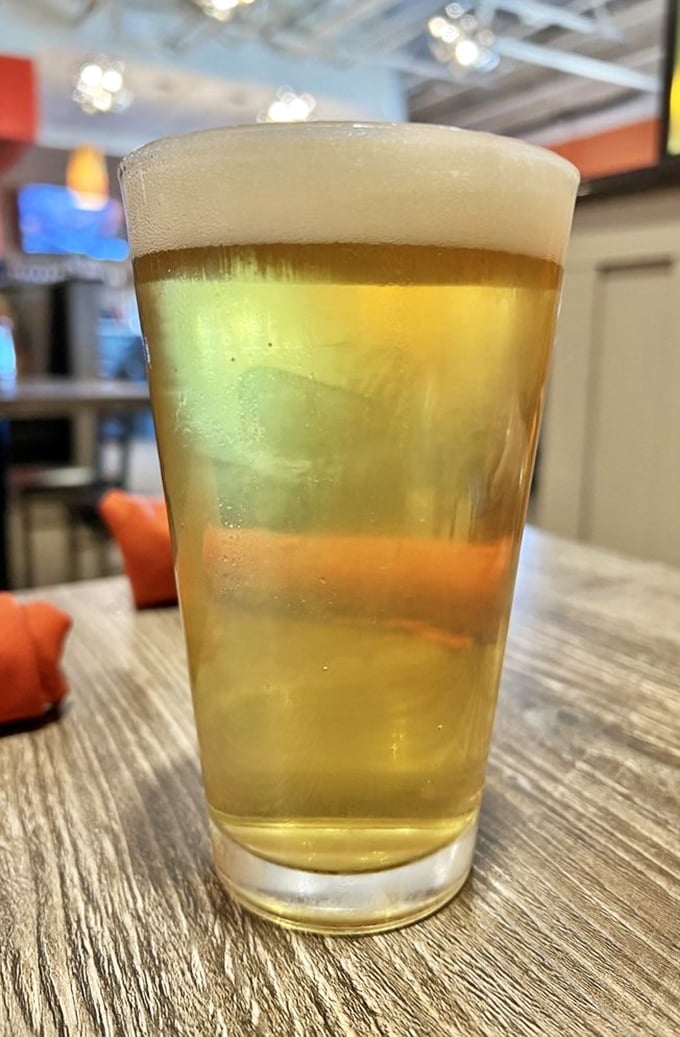 A perfectly poured beer with that Instagram-worthy foam cap—the ideal companion for when you're about to make some questionable food decisions.