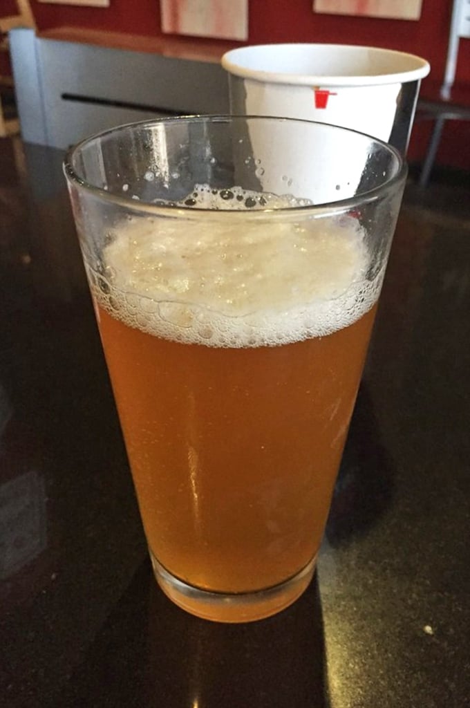 A cold beer waiting to meet its meaty soulmate. In the barbecue world, this amber companion is less a beverage and more a necessary supporting character.