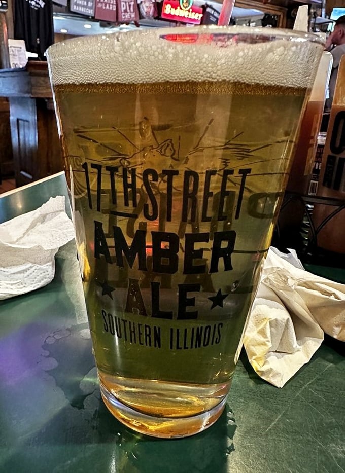 The 17th Street Amber Ale—because proper barbecue demands proper hydration. That foam cap is practically winking at you.