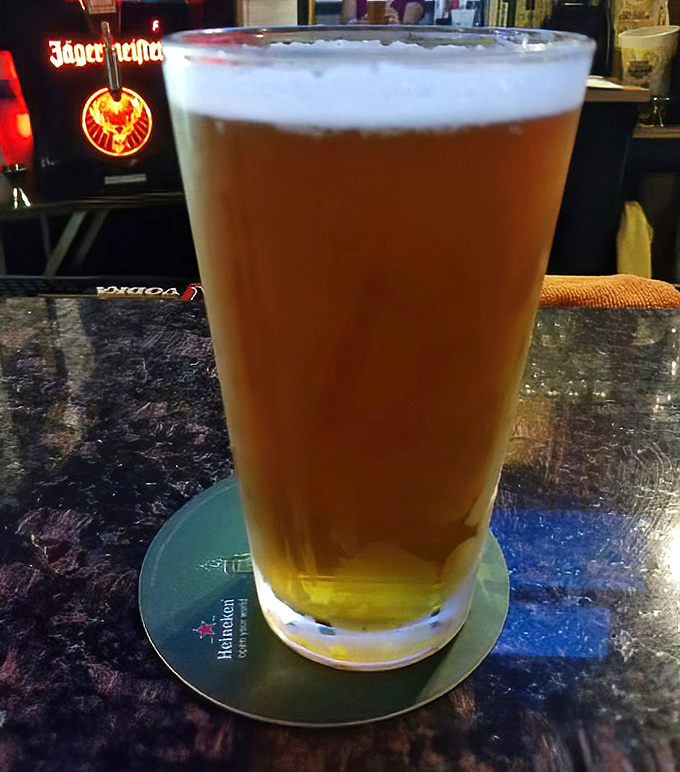 A perfectly poured beer – the ideal companion for sandwich adventures. Like finding a glass slipper that fits your exact thirst level.