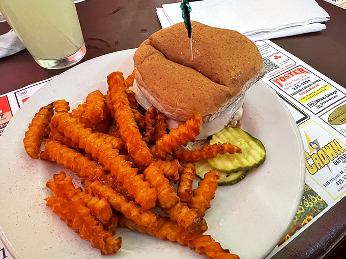 This sandwich doesn't just sit on the plate—it commands attention with its towering presence, like the Everest of lunch options.