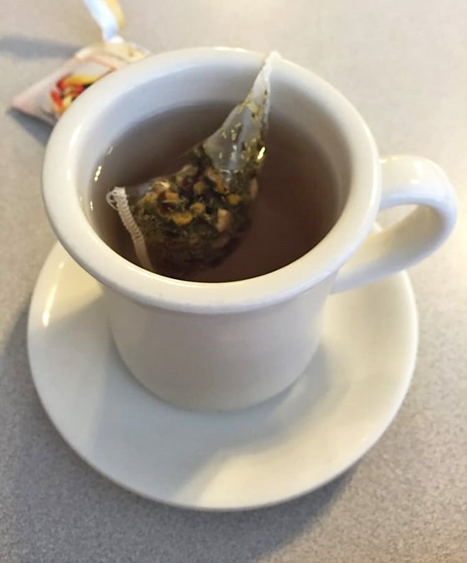 A simple cup of tea becomes a moment of zen amid breakfast chaos—the steam rising like morning fog over Delaware farmland.