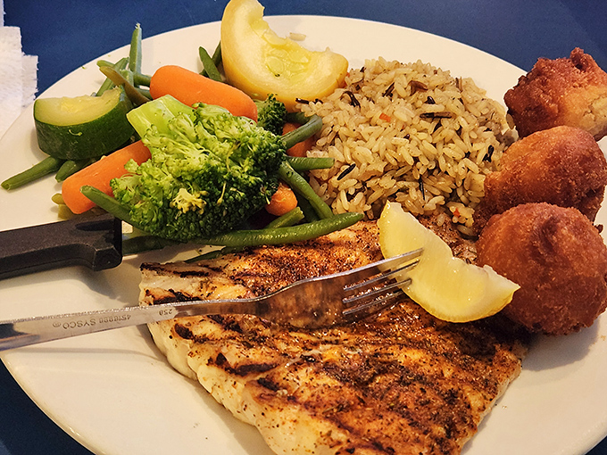 Blackened grouper that's spiced just right – proof that sometimes the best seasoning is restraint and respect for the fish.