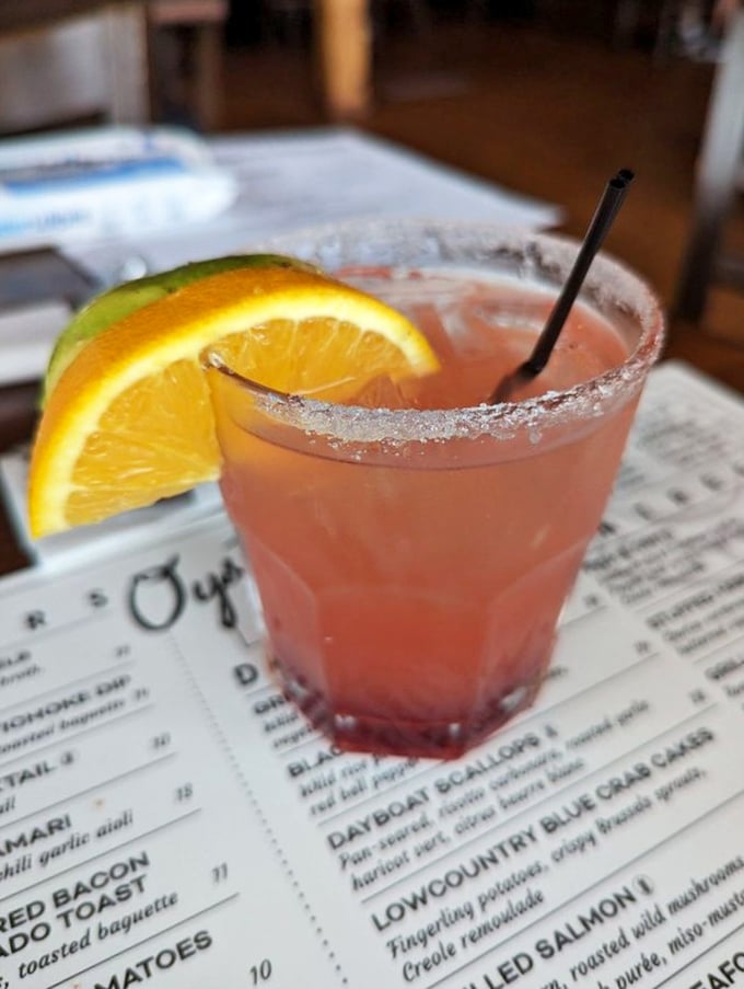 This isn't just a margarita—it's a sunset in a glass, rimmed with promise and garnished with vacation vibes.