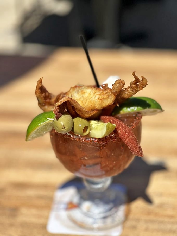 This isn't just a Bloody Mary—it's breakfast, appetizer, and cocktail in one glass. The seafood garnish is basically a bonus meal.