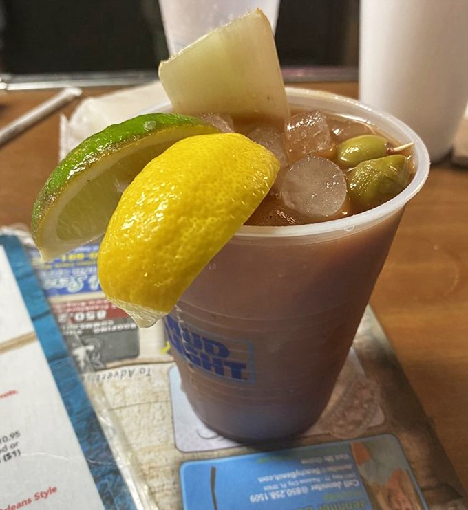 This isn't just a Bloody Mary—it's a liquid appetizer that comes with its own garnish garden. The perfect companion while waiting for your oysters.