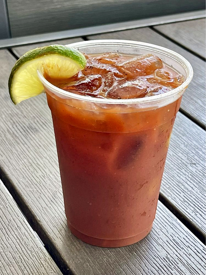 Not just a Bloody Mary – it's breakfast, appetizer, and vacation spirit all in one gloriously spiced glass. That lime is living its best life.