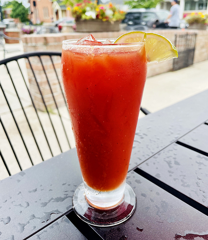 A Bloody Mary on the patio—spicy, refreshing, and garnished with lime. The perfect companion for weekend brunch conversations that stretch into afternoon.