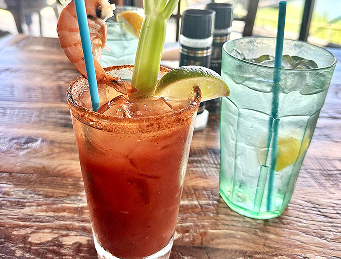 The Bloody Mary comes with its own shrimp garnish – because in Florida, even the cocktails have seafood appetizers built right in.