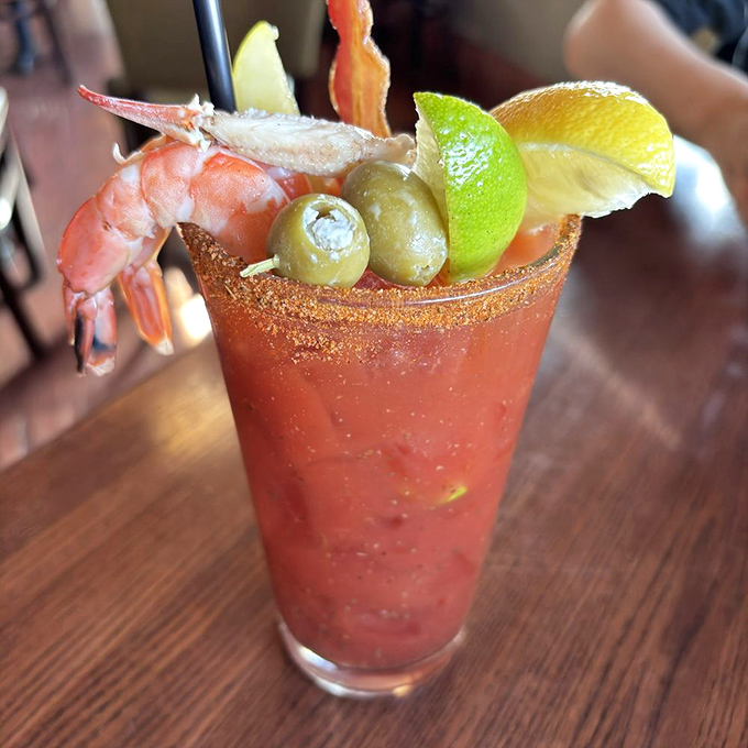 This isn't just a Bloody Mary—it's a meal in a glass, complete with a shrimp perched on the rim like it's enjoying the view.
