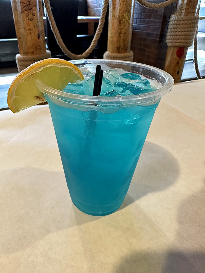 This electric blue lemonade isn't just Instagram-worthy – it's the perfect cool counterpoint to the spicy seafood heat. Ocean-colored refreshment!