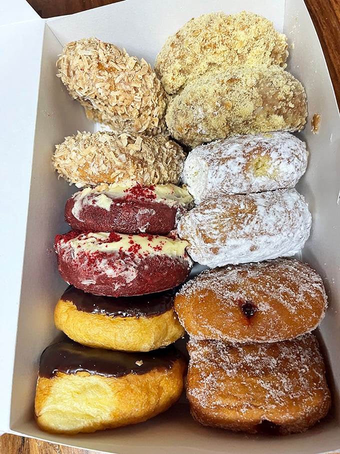 A box of donuts from The Donut Hole isn't just breakfast—it's an edible art gallery that won't last long enough for appreciation.