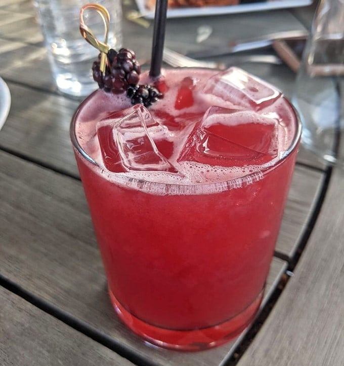 This vibrant cocktail, garnished with fresh berries, isn't just a drink—it's summer in a glass, regardless of what season it actually is outside.