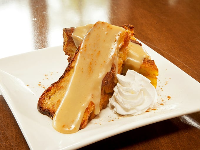 Bread pudding swimming in caramel sauce that makes you understand why dessert stomachs evolved separately from dinner stomachs. 