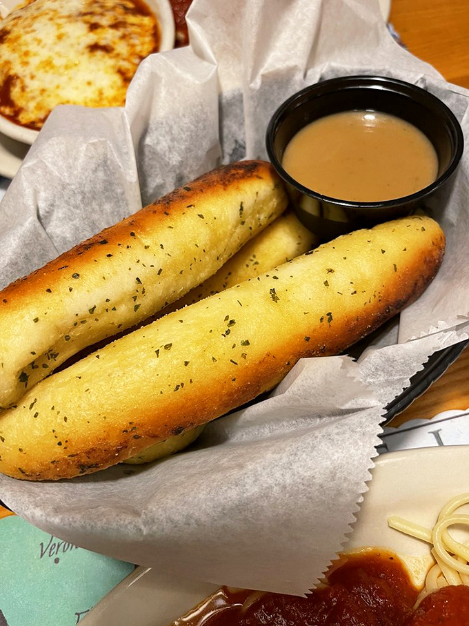 These breadsticks aren't just appetizers—they're diplomatic envoys from Carb Country. Golden, herb-flecked, and ready for their dipping destiny.