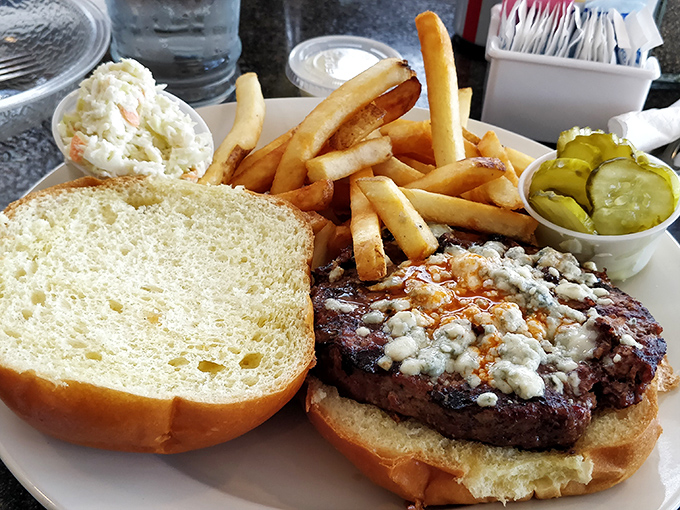 This burger isn't trying to reinvent the wheel—it's just perfecting it. Blue cheese crumbles add that tangy punch that makes ordinary Wednesday lunches extraordinary.
