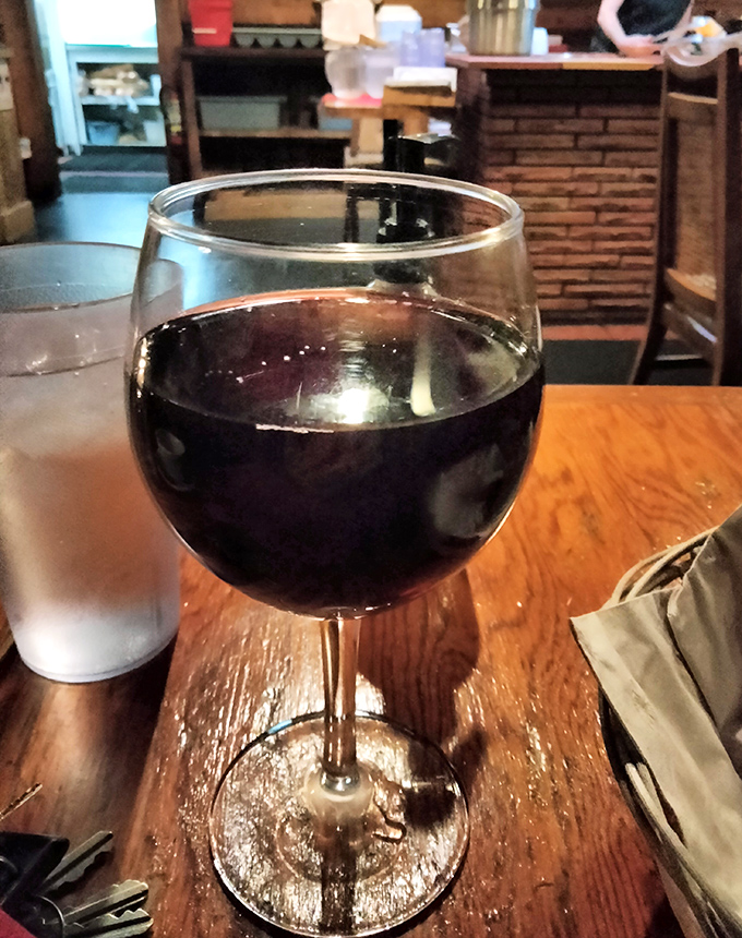 A generous pour of Cabernet Sauvignon catching the light just right—because every great steak deserves a worthy dance partner.