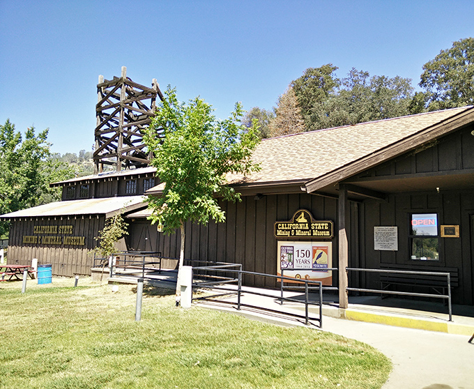 Mining equipment that helped build California stands sentinel at the State Mining Museum. This wooden wheel once turned dreams into reality during gold rush fever.