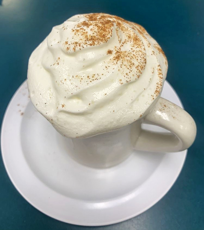 This isn't just coffee—it's a cappuccino masterpiece topped with a cloud of foam so perfect it deserves its own Instagram account.