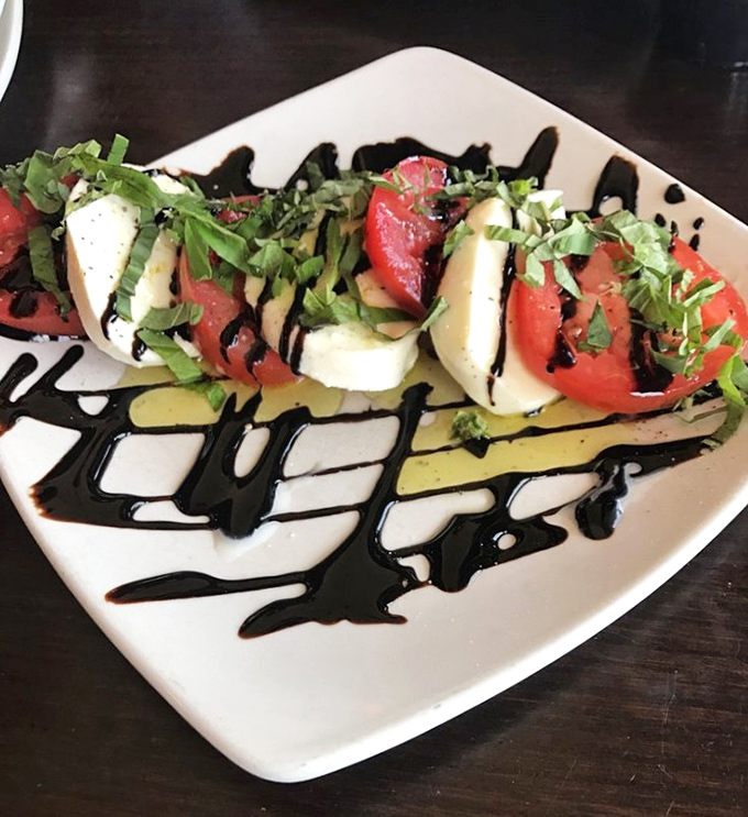 A caprese salad that reminds you why the Italians got it right. Fresh mozzarella, tomatoes, and balsamic—summer on a plate, regardless of season.