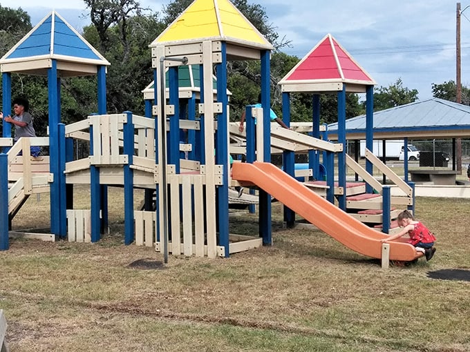 Childhood joy engineered in primary colors. This playground has launched a thousand memories and at least as many "Watch me, Mom!" moments.