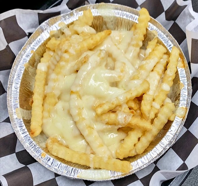 Cheese fries that don't mess around. The crispy exterior gives way to fluffy potato beneath that molten cheese blanket.