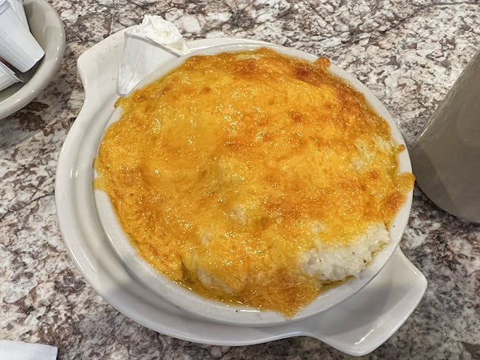 Cheese grits that have achieved that golden-topped perfection – the kind of dish that makes Northerners finally understand what Southerners have been raving about.