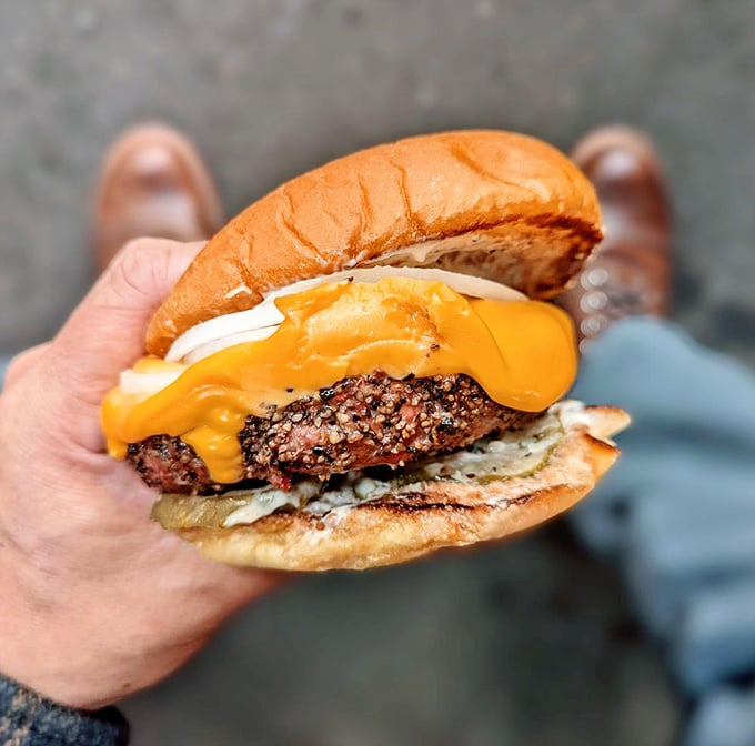 A burger that doesn't just speak to you—it serenades you with promises of juicy, smoky satisfaction in every bite.