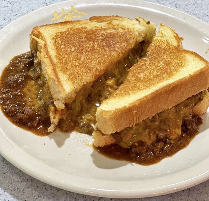 The chili melt—where grilled cheese meets Cincinnati's signature sauce in a gooey, messy love affair worth every napkin.