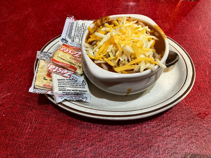 This isn't just chili – it's a warm hug in a bowl, topped with enough cheese to make Wisconsin proud.