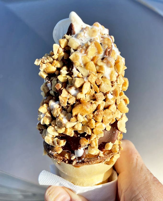 This isn't just a nut-covered ice cream cone—it's edible architecture, a testament to the beauty of simple pleasures done extraordinarily well.